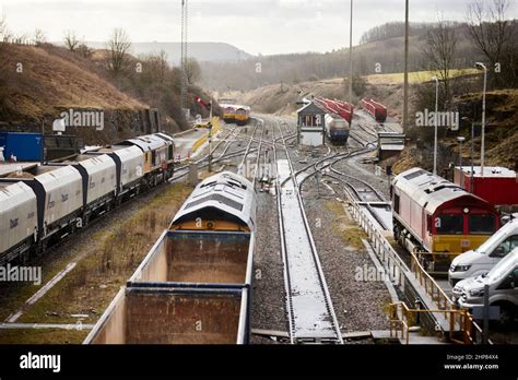 Left British Rail Class 66 66725 Leaving CEMEX Dove Holes Quarry Into