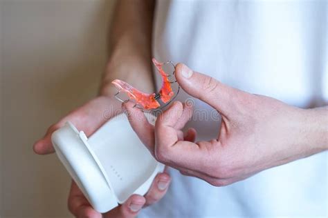 Orthodontic Palatal Expander In Hand With Storage Case Stock Image