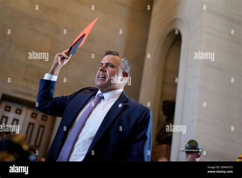Rep Jason Powell D Nashville Holds Up A Sign Outside The House Chamber After A Special