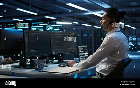 Data Center Computer Scientist Wearing Mic Headset Doing Installation