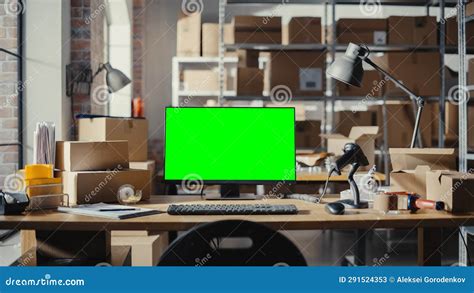 Desktop Computer Monitor Standing On A Table With A Green Screen Chromakey Mock Up Display