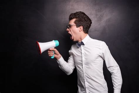 Premium Photo Male Nerd With Megaphone Screaming