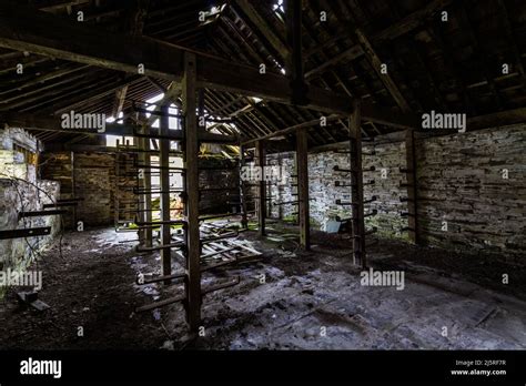 Old Store Room In Abandoned Slate Quarry With Metal Racks Disused