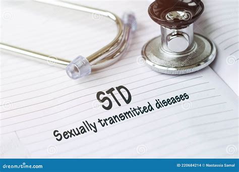 STD Sexually Transmitted Diseases Text On A Medical Card Next To A Pen Stethoscope Stock