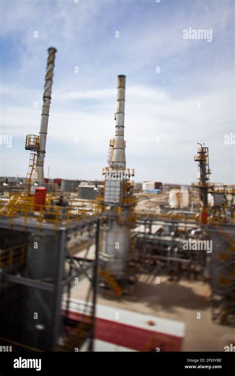 Oil Refinery Plant In A Desert Refinery Column And Plant Chimney Partially Blurred Tilt