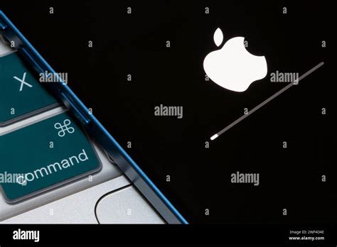 Closeup Up Of The Apple Logo And Progress Bar Seen On An Iphone When The Ios Firmware Is Being
