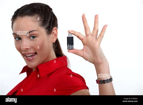 A Brunette Holding A Usb Key Stock Photo Alamy