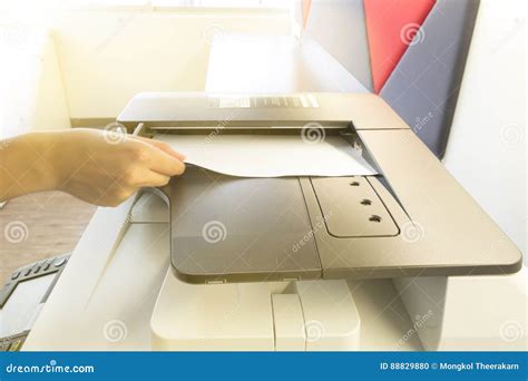 Man Copying Paper From Photocopier With Access Control For Scanning Key Card Sunlight From