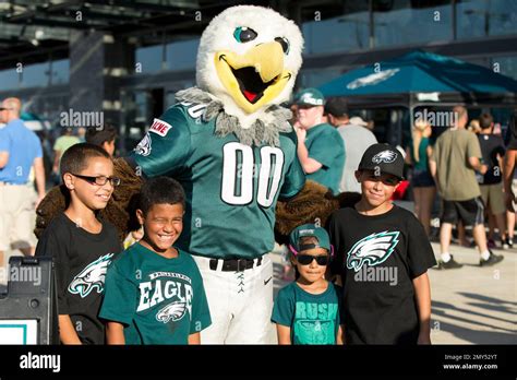 Philadelphia Eagles Mascot Swoop Poses For A Photo With Fans During
