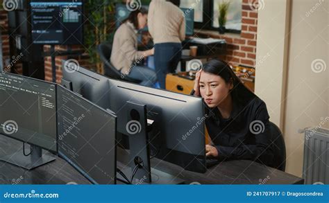 Portrait Of Asian Programer Focused On Writing Code Encounters Unexpected Compiling Error Stock