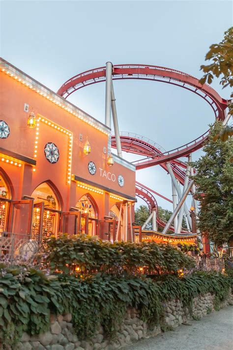 View Of A Building And A Rollercoaster In The Amusement Park · Free