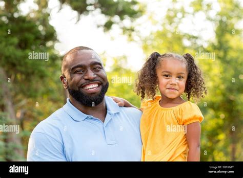Father Laughing And Playing With His Daugher Stock Photo Alamy