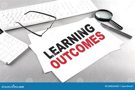 Learning Outcomes Text On A Paper On A Gray Background Near A