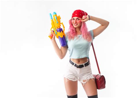 Premium Photo Sexy Girl With A Water Gun In Summer Clothes Isolated