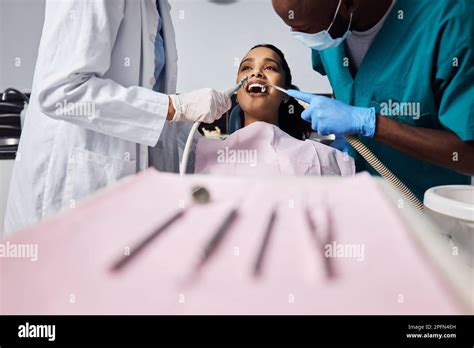 A Positively Pain Free Experience A Young Woman Having Dental Work