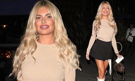 Megan Barton Hanson Puts On A Very Leggy Display In A Black Mini Skirt And Knee High Boots