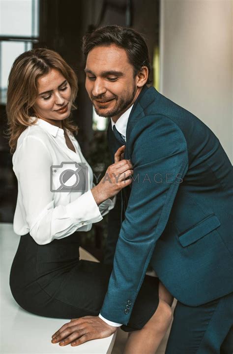 Smiling Couple Flirting At Workplace Intimate Relationship Or