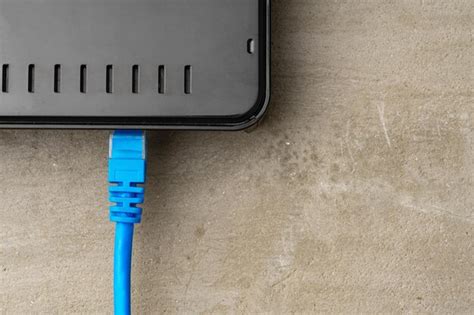 Premium Photo Modern Router With Cables Plugged In Close Up