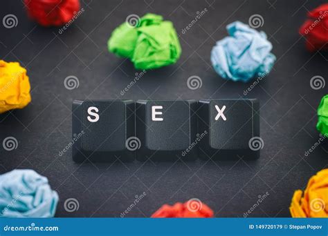 The Word Sex On A Black Background With Some Colorful Crumpled Paper Balls Around It Stock Image