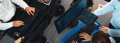 Premium Photo Software Development Team Working Together In Office Coding Script Display On