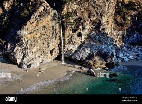 Mcway Falls Cascading Onto A Beach In Julia Pfeiffer Burns State Park