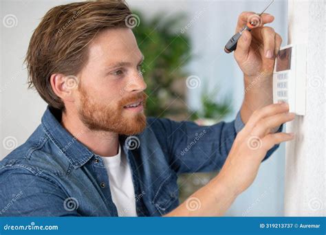 Man Installing Security System Door Sensor On Wall Stock Image Image Of Sensor Inside