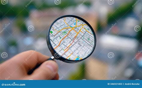 Hand Holding Magnifying Glass Over A Map Finding Hidden Pathways