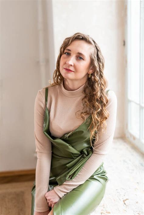 Portrait Of A Beautiful Young Girl With Long Curly Hair In A Green Dress Stock Image Image Of