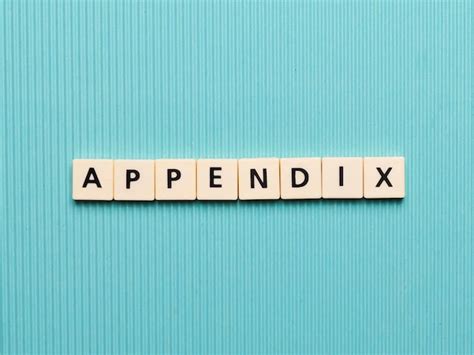 Premium Photo Appendix Word Made From Square Letter Tiles On Turquoise Background