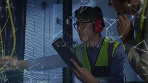 Animation Of Shapes Moving Over Diverse Workers Using Tablet In Server Room Stock Footage
