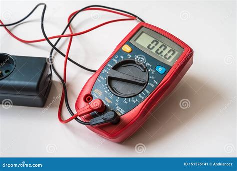 Measurement Of Voltage In Electrical Socket Digital Multimeter Stock