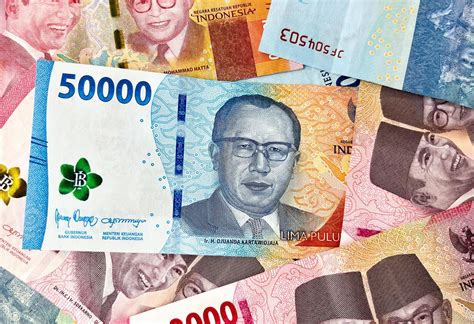 Red And Blue Colored Five Thousand And One Hundred Thousand Indonesian Rupiah Paper Money