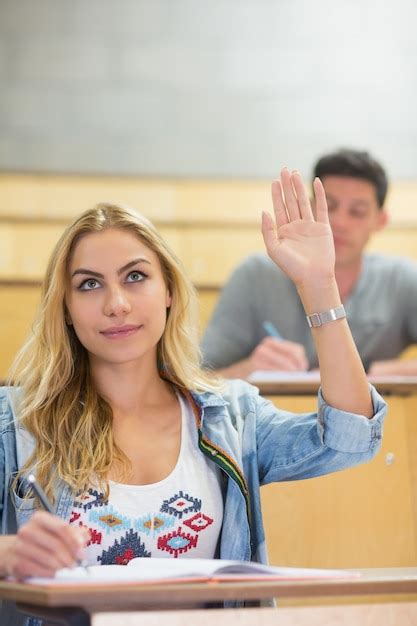 Premium Photo Attractive Student Raising Hand During Class At The