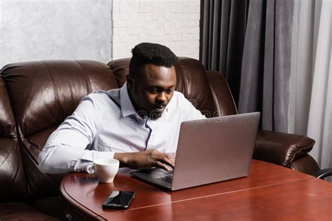 African American It Developer With Laptop Is Programming Code In Office African Business Man