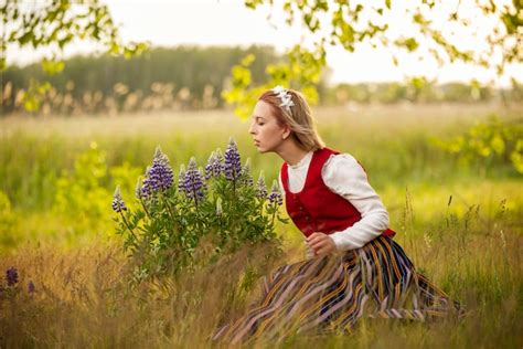 Premium Photo | Latvian woman in traditional clothing in field