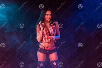 Young Woman In Erotic Fetish Wear Dancing Striptease In Nightclub Nude