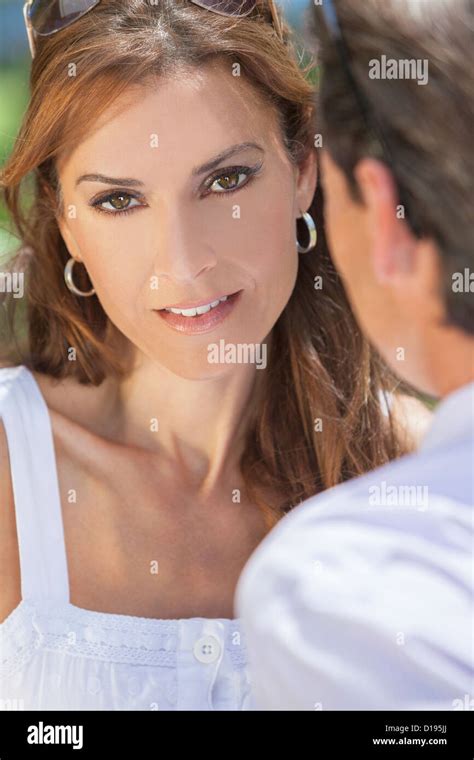 Outdoor Portrait Of A Beautiful Middle Aged Brunette Woman In Her