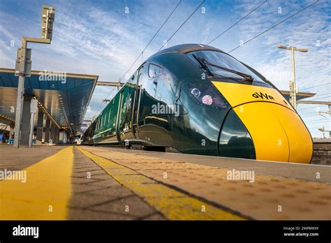 A Great Western Class 802 Locomotive Pulls Away From The Platform At
