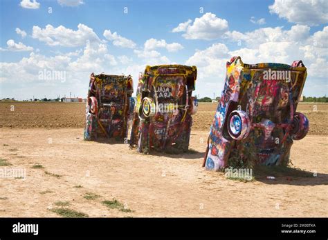 The Cadillac Ranch Is A Public Art Installation With Graffiti Spray