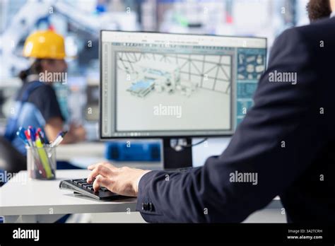 Photovoltaics Factory Worker Programming Solar Manufacturing Machinery Using Pc Finetuning