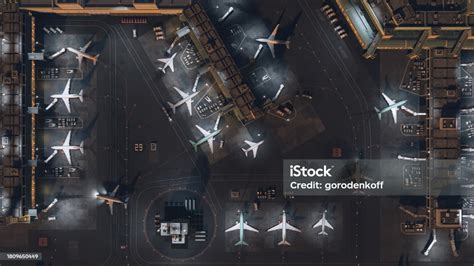 3d 상업 공항의 조감도는 비행기 여객 터미널 활주로 및 서비스 기계로 렌더링됩니다 저녁에 국제 항구에서 움직이는 현대 Vfx 항공기의 위에서 내려다보는 모습 항공우주