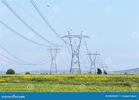 Part Of Electricity Transmission Power Line High Voltage Tower With Glass Insulators Stock