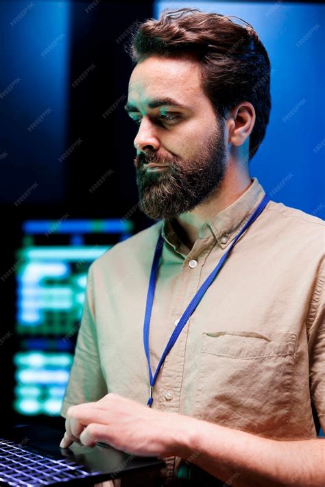 Premium Photo Skillful Engineer Using Laptop To Find Flaws In Data