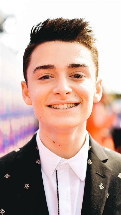 Noah Schnapp Smiling For Phone Background Wallpaper Wallpapersok
