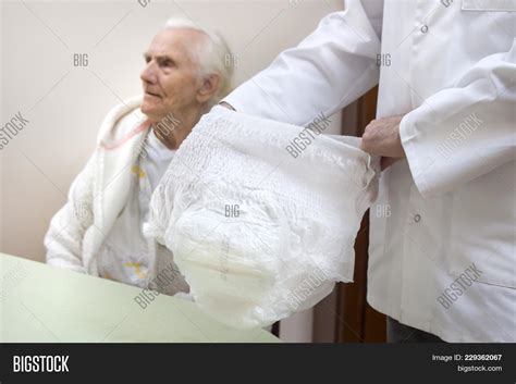 Nurse Shows Diaper Image And Photo Free Trial Bigstock