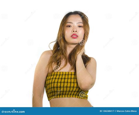 Portrait Of Young And Playful Asian Woman Posing Fresh And Naughty In