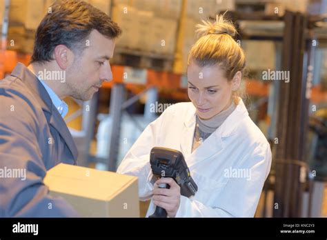 Female Worker Using A Barcode Scanner Stock Photo Alamy