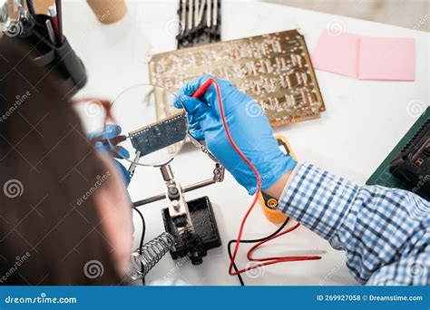 Measurement With A Multimeter Of Resistance In The Computer Board Checking Circuit Board With