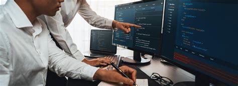 Premium Photo Software Development Team Working Together In Office Coding Script Display On