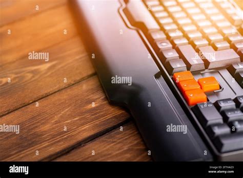 Orange Arrow Keys On A Black Keyboard Up Down Left Right Buttons On A Gaming Computer